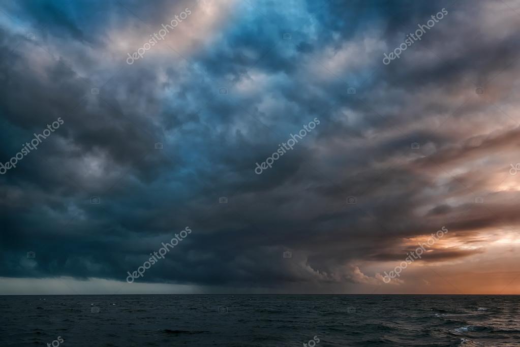 Rain clouds forming over ocean Stock Photo by ©kelpfish 110877234