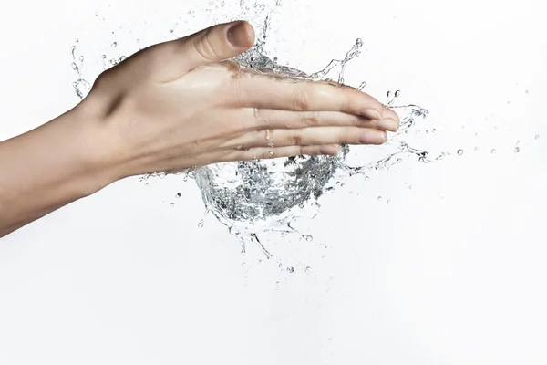 Woman hand in water splash — Stock Photo © chepko #5645197