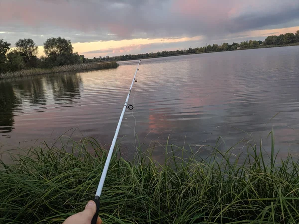 fishing in a beautiful place. fishing rod and water. fisherman at ...