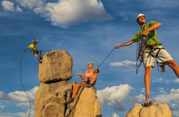 Husband and wife climbing team on the summit. - Stock Image - Everypixel