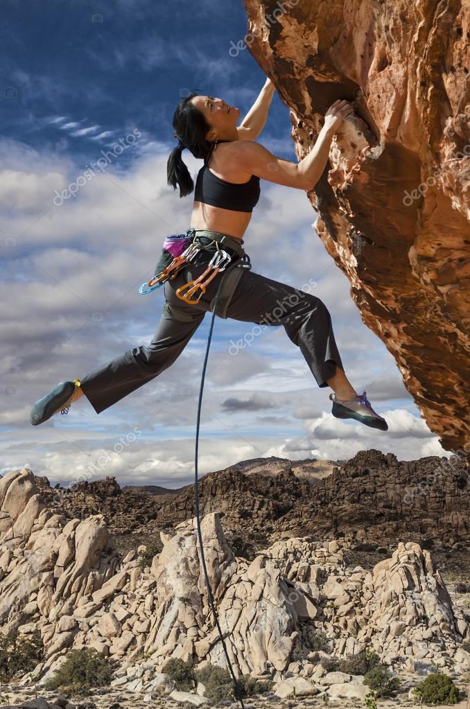Rock climber clinging to a cliff. Stock Photo by ©gregepperson 91558558