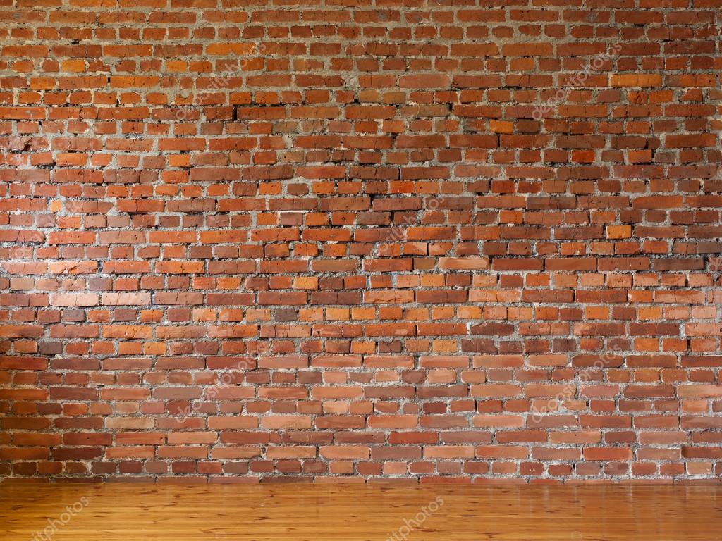 Room with red brick walls and wooden flooring of boards — Stock Photo ...