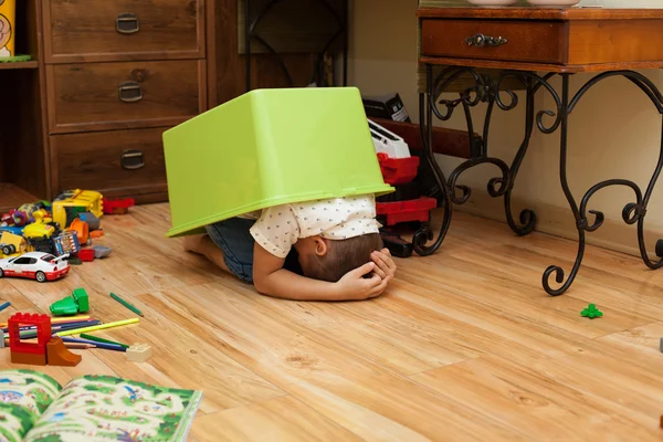 Little boy hiding in a cupboard and crying — Stock Photo © Zdyma4 #90780992