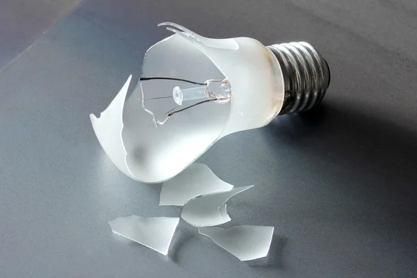 Broken light bulb Stock Photo by ©CLIPAREA 13279855