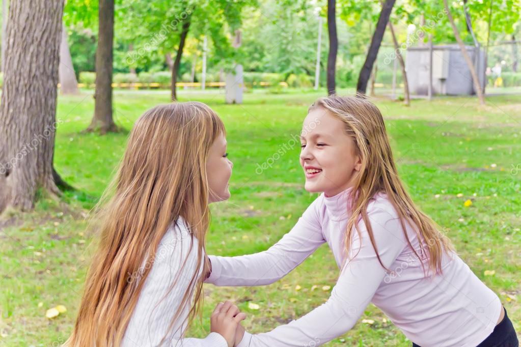 Cute two playing girls Stock Photo by ©julialine 62943875