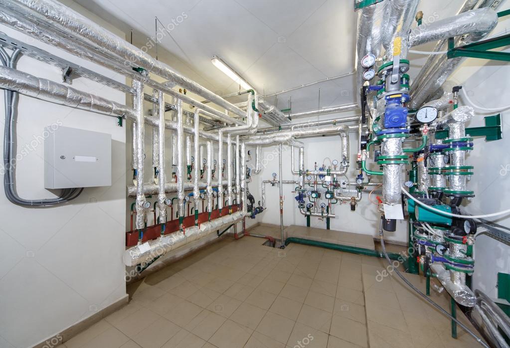 Heat substations interior with lots of pipes, gauges and measuri ...