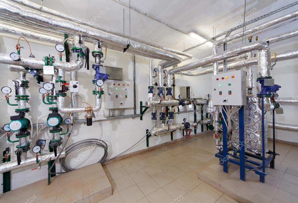 Heat substations interior with lots of pipes, gauges and measuri ...