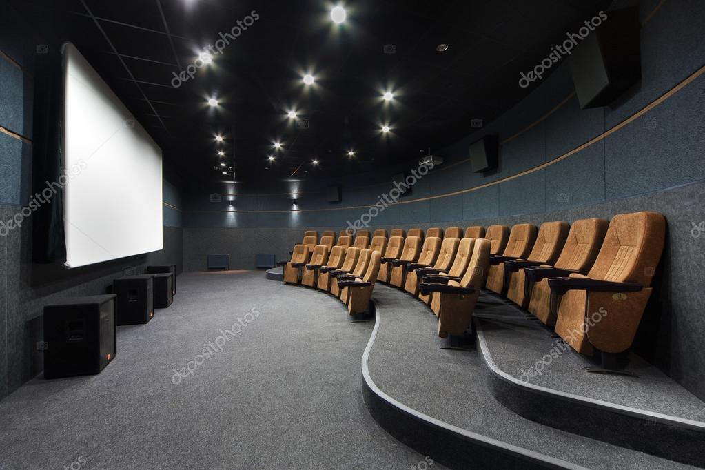 Interior of a small theater with orange chairs and screen Stock Photo ...