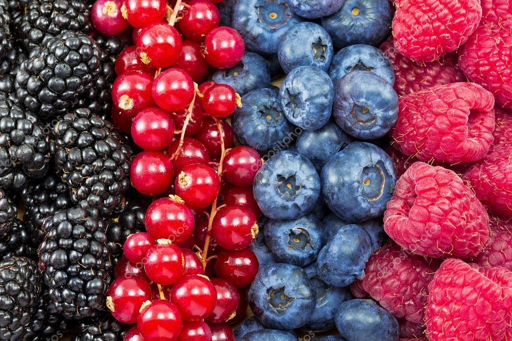 Different fresh berries as background Stock Photo by ©Preto_perola 76132195