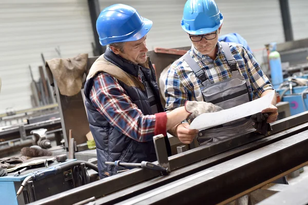 Engineers working on project Stock Photo by ©Goodluz 122396996