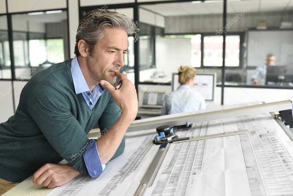 Architect working on project — Stock Photo © Goodluz #122398406 Architect working on project — Stock Photo © Goodluz #122398406