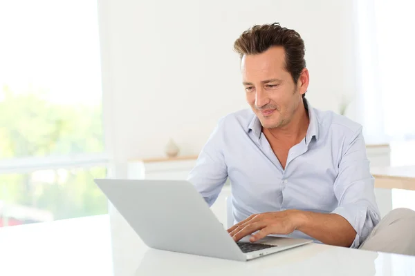 Man using laptop at home - Stock Image - Everypixel