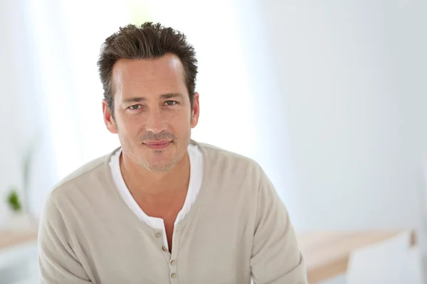 Handsome 40-year-old man — Stock Photo © Goodluz #53346991