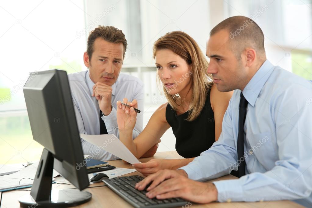 Business people working on computer Stock Photo by ©Goodluz 53369407