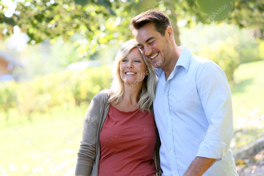Couple walking hand in hand — Stock Photo © Goodluz #58090439