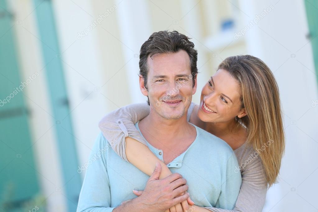 Middle-aged couple embracing — Stock Photo © Goodluz #64685297