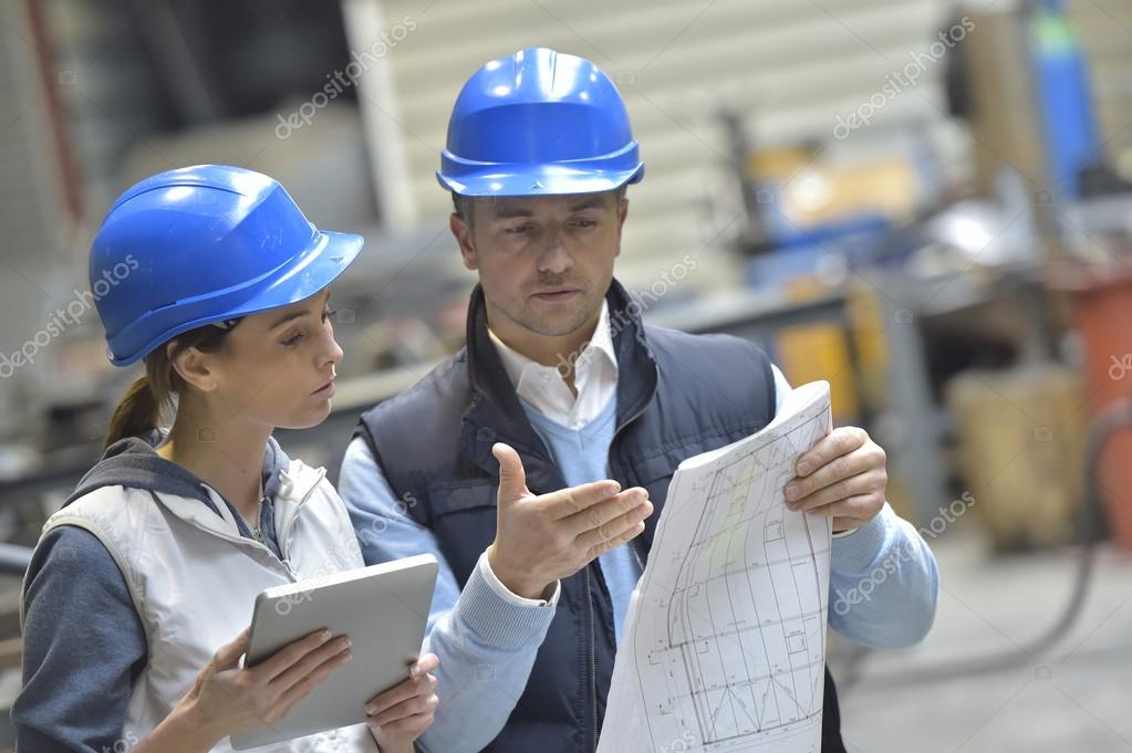 Engineers reading instructions — Stock Photo © Goodluz #67893525