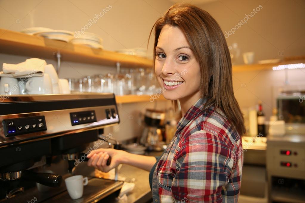 Coffeeshop keeper preparing expresso Stock Photo by ©Goodluz 67894695