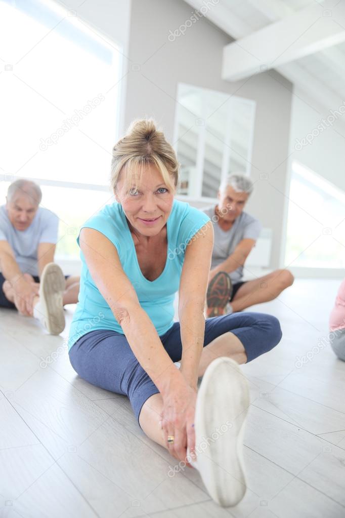 People doing stretching exercises Stock Photo by ©Goodluz 85187770 People doing stretching exercises Stock Photo by ©Goodluz 85187770