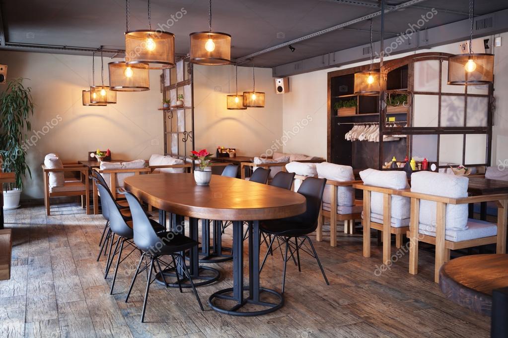 Modern european cafe interior. Stock Photo by ©luckyraccoon 110046046