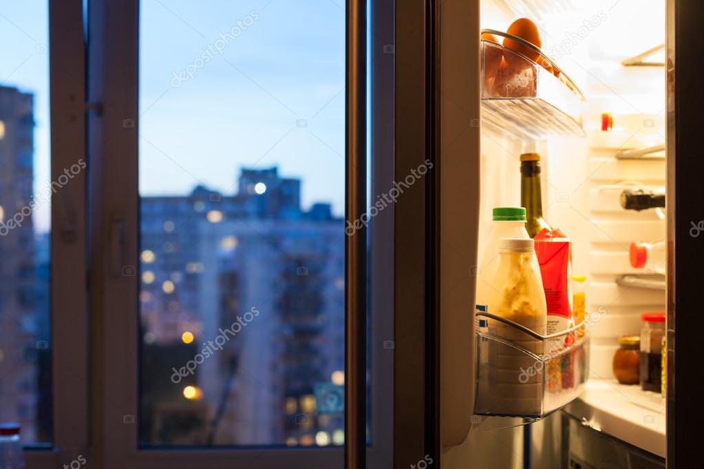 Open door of refrigerator with meal in evening Stock Photo by ©vvoennyy ...