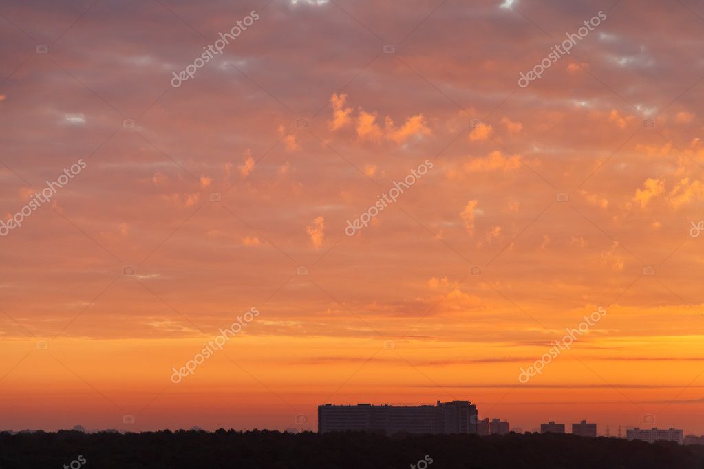 Red sunrise clouds over apartment house — Stock Photo © vvoennyy #53540547