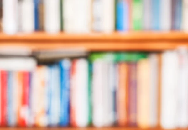 Blurred background from books in library Stock Photo by ©vvoennyy 81927064