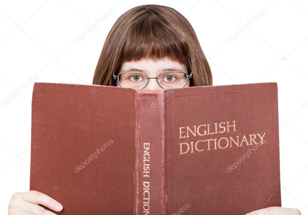Girl with spectacles looks over English Dictionary — Stock Photo ...