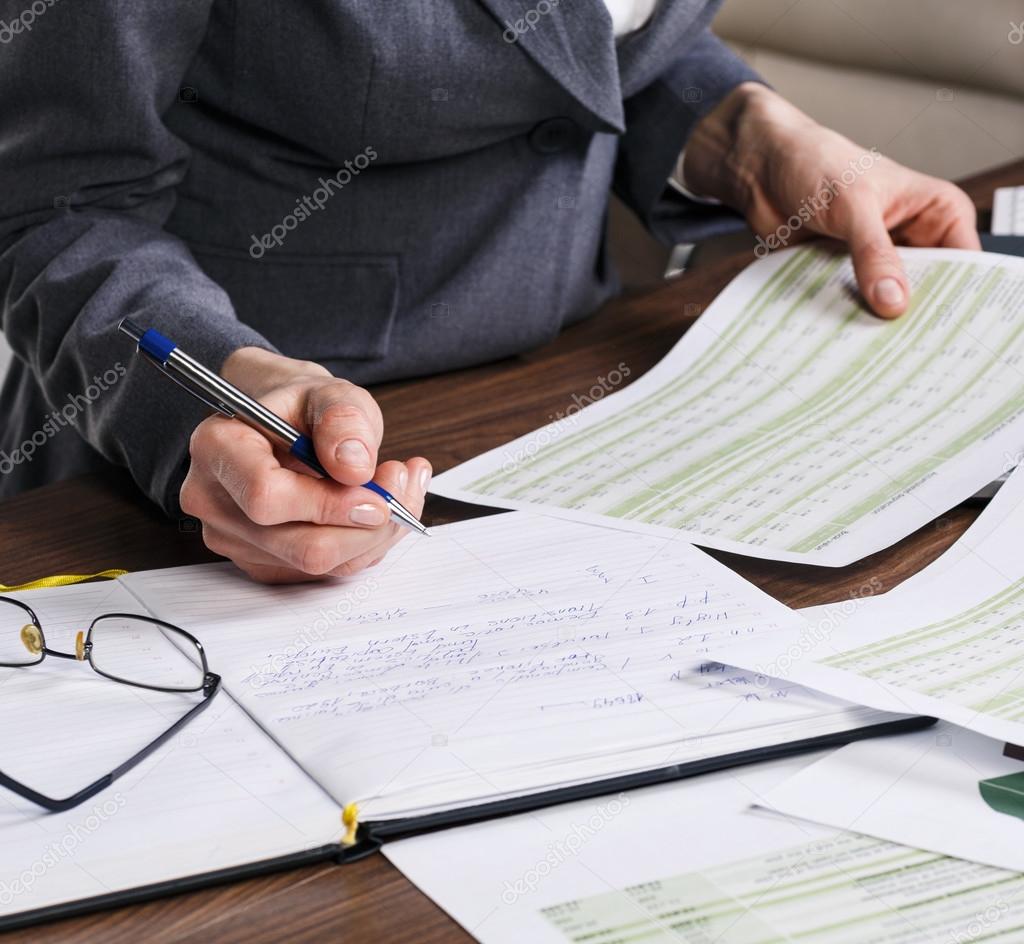 Calculating on the office desk — Stock Photo © kotin #80470566