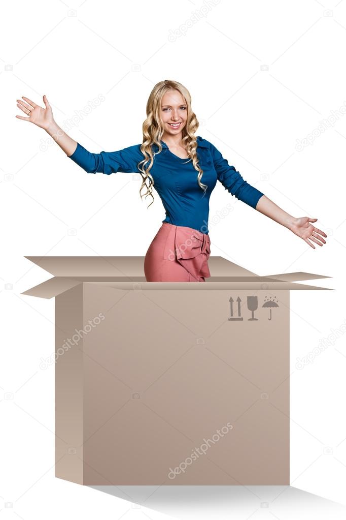 Beautiful girl inside a cardboard box Stock Photo by ©kotin 84583772