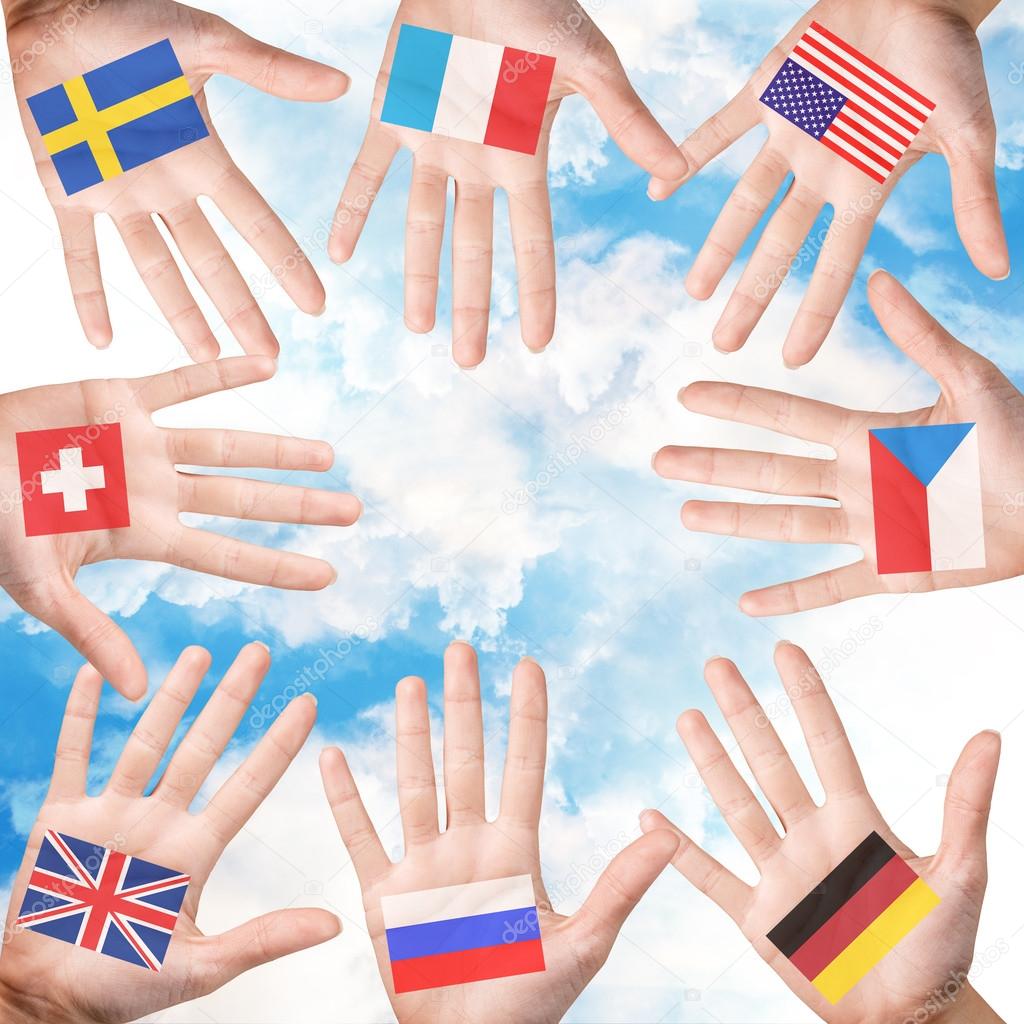Woman hands with countries flags Stock Photo by ©kotin 93321216