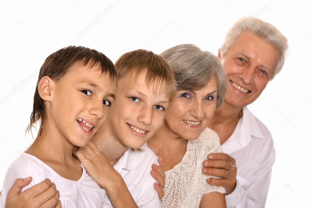 Happy grandparents and two grandchildren Stock Photo by ©aletia 55492853