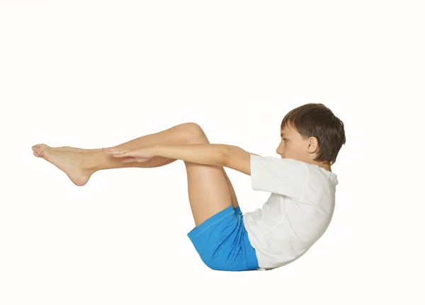 Young boy doing exercises Stock Photo by ©aletia 200300306