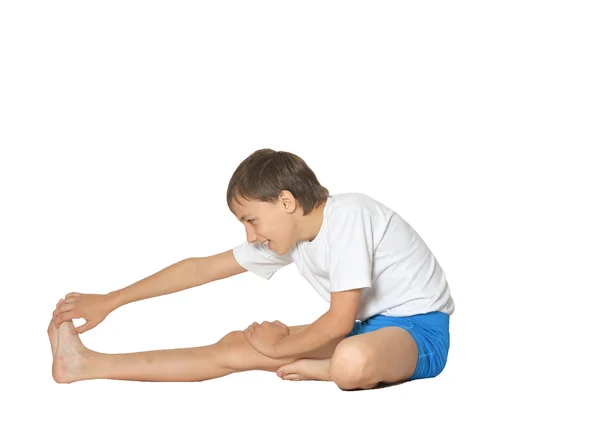 Young boy doing exercises Stock Photo by ©aletia 200300306