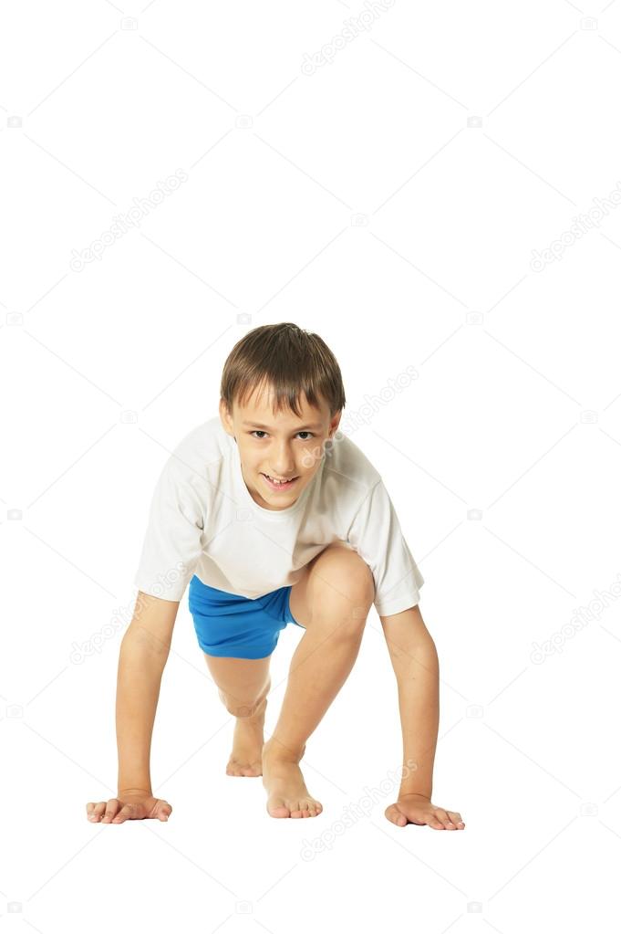 Young boy doing exercises Stock Photo by ©aletia 59852617