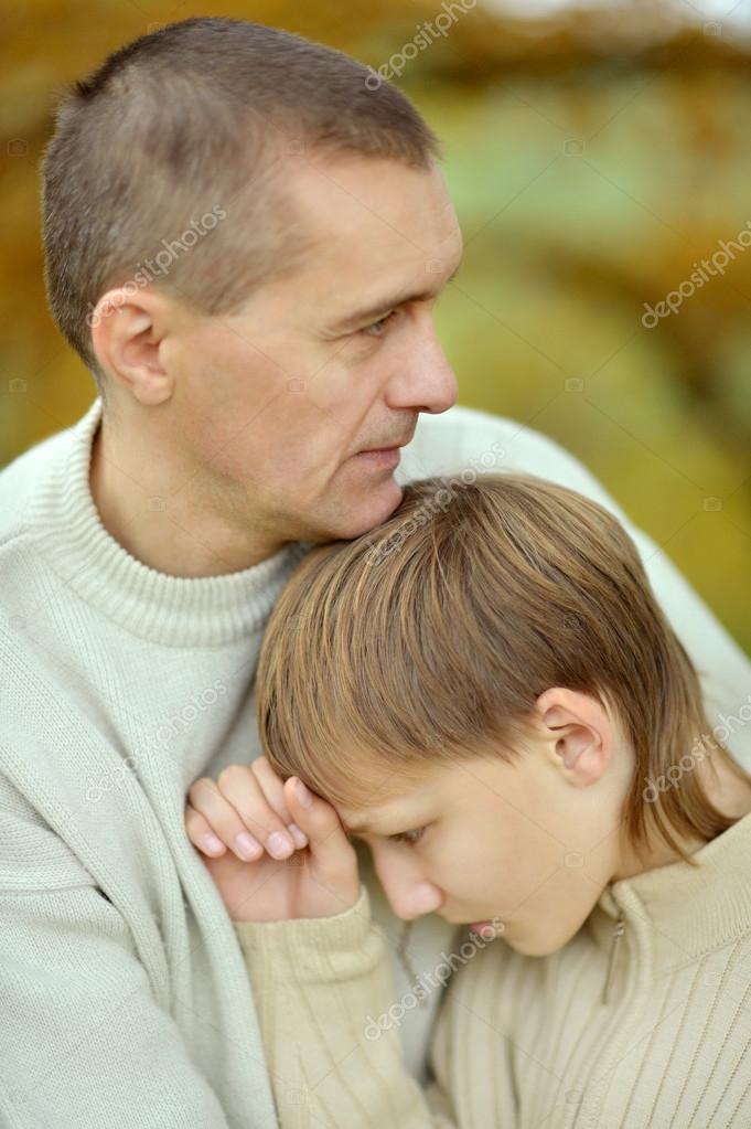 Sad father and boy in park — Stock Photo © aletia #62955251