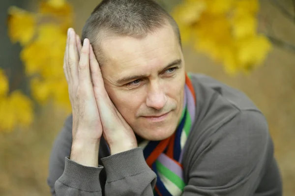 Sad man in early autumn - Stock Image - Everypixel