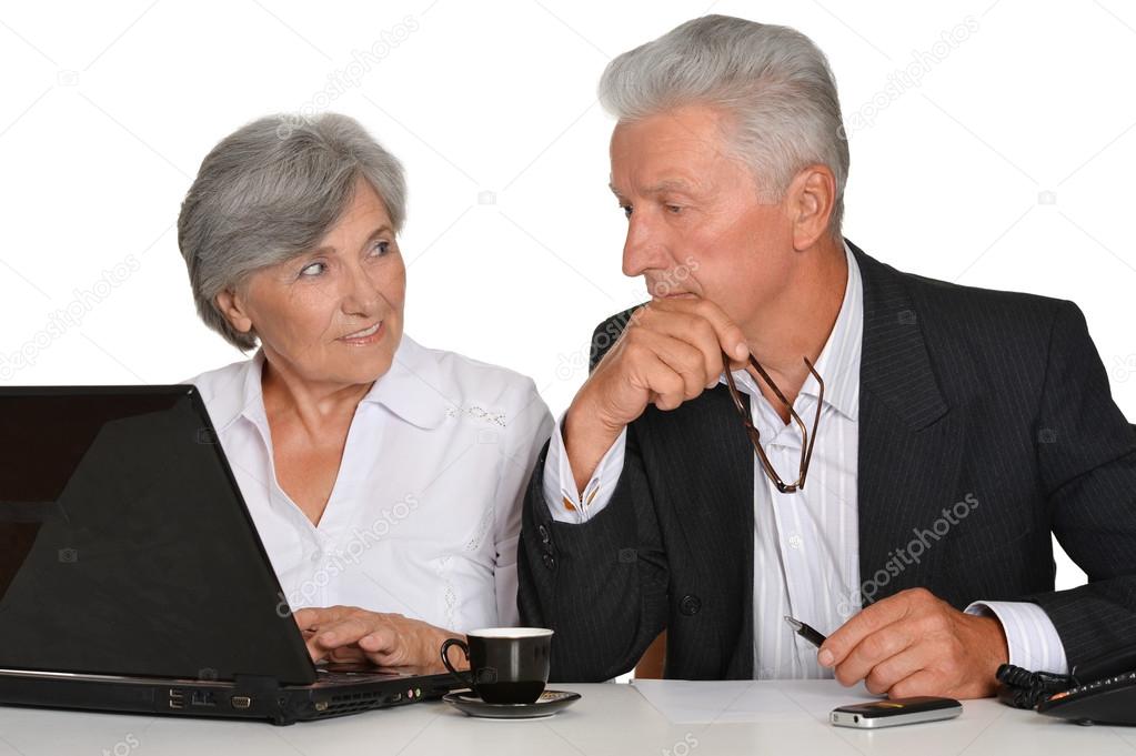 Elderly people working with laptop Stock Photo by ©aletia 74097173
