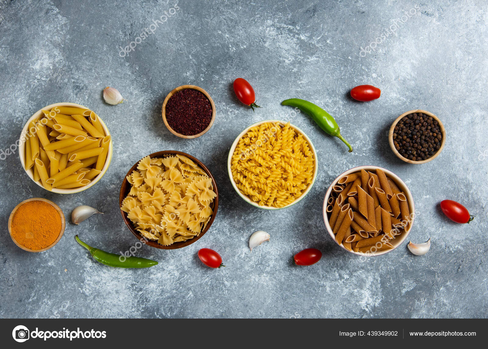 Different types of raw macaroni and vegetables Stock Photo by ...