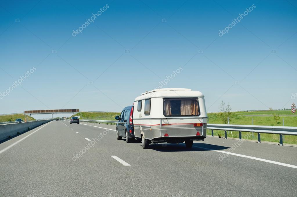 RV van and trailer driving fast to vacance destination — Stock Photo ...