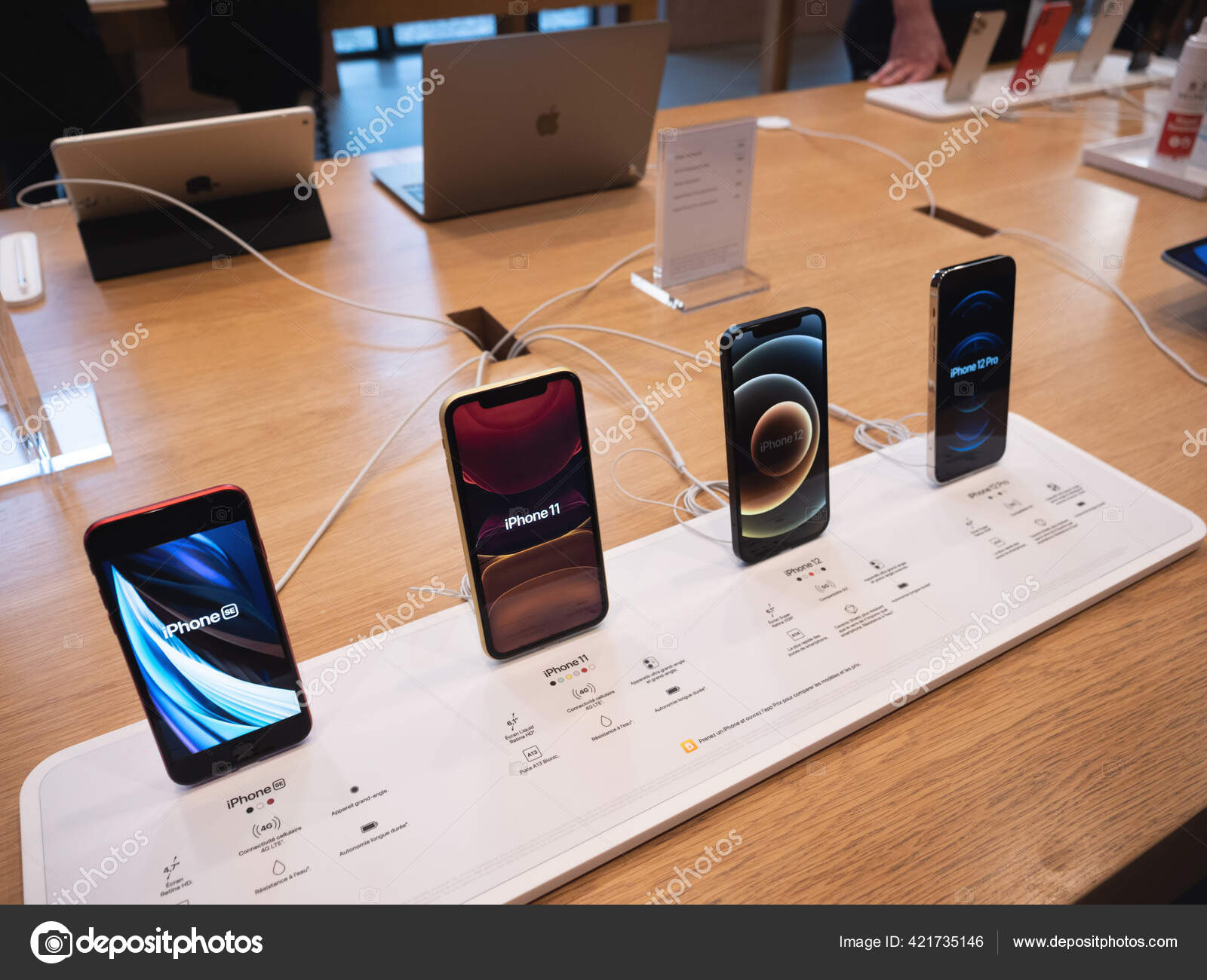 New iPhone 12 and iPhone 12 Pro on display during launch day next to SE ...