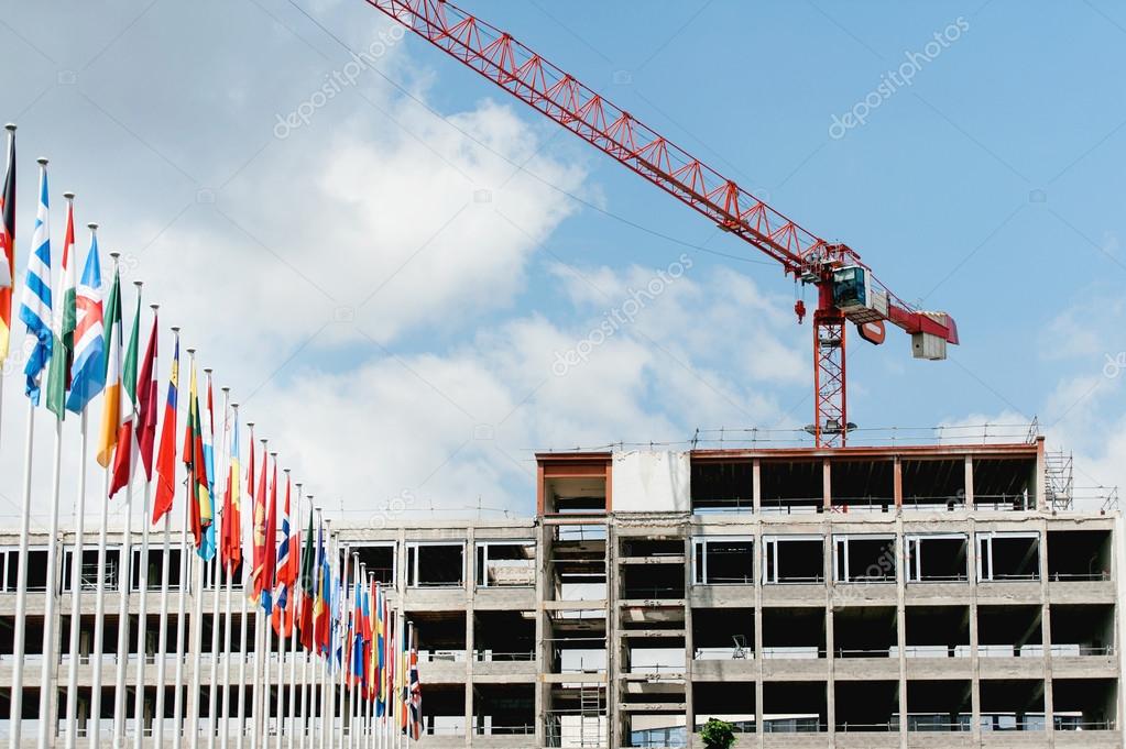 All European Countries flags with construction building crane in ...