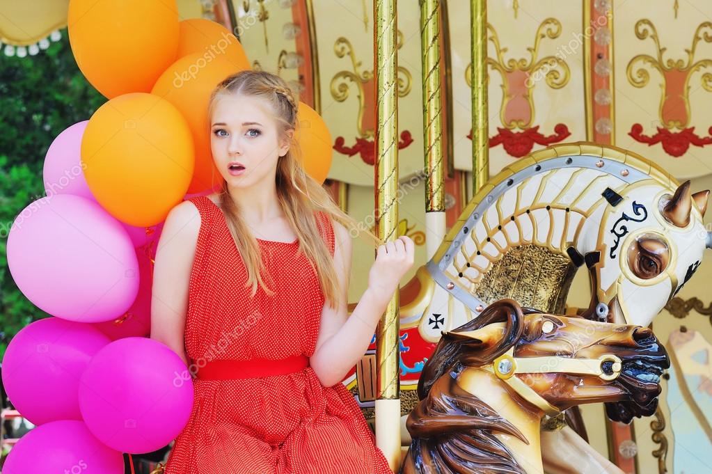 Young model woman riding a carousel Stock Photo by ©zoiakostina 78618154