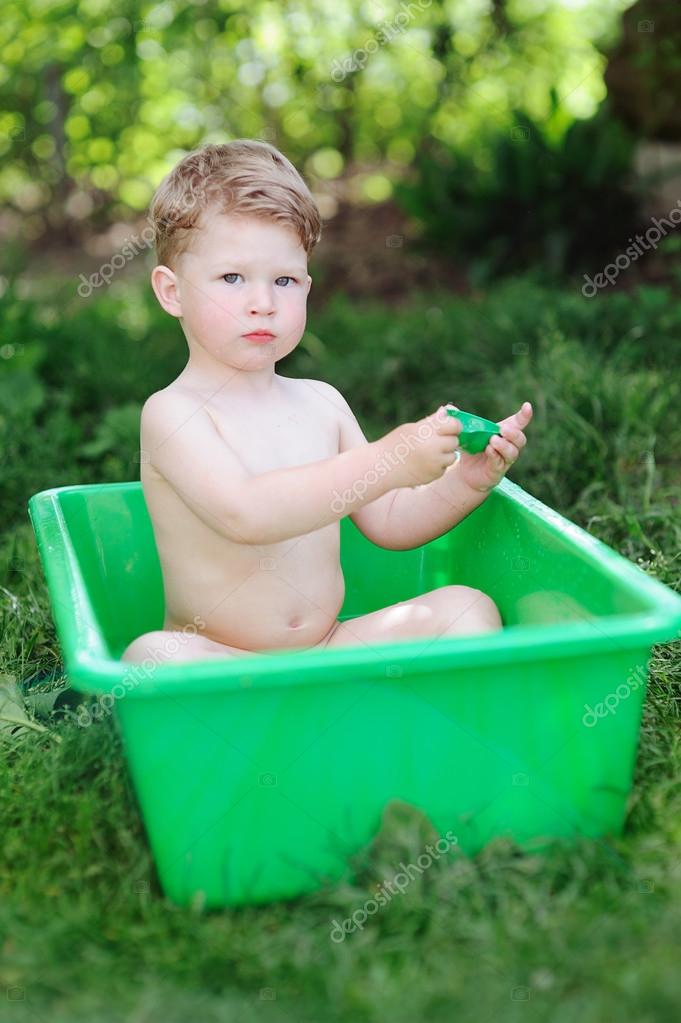 Little boy taking a bath in summer garden — Stock Photo © Moravska ...