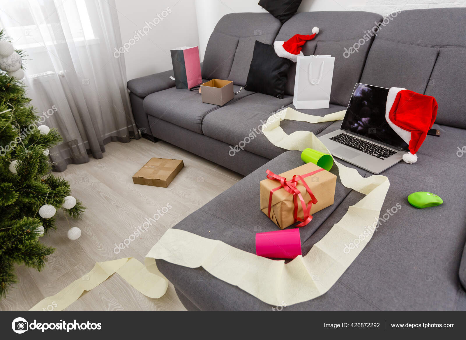 Messy living room interior with Christmas tree. Chaos after party Stock ...