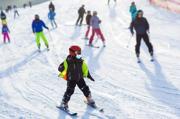 Coronavirus in winter. Skiing with face mask. winter vacation in ...