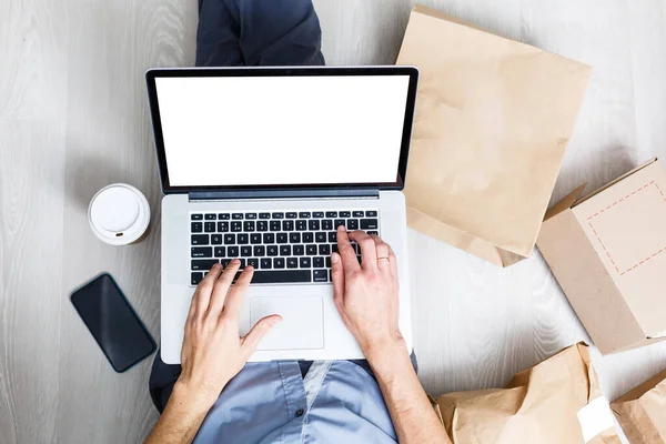 Back view of male person sitting front open laptop computer with blank ...