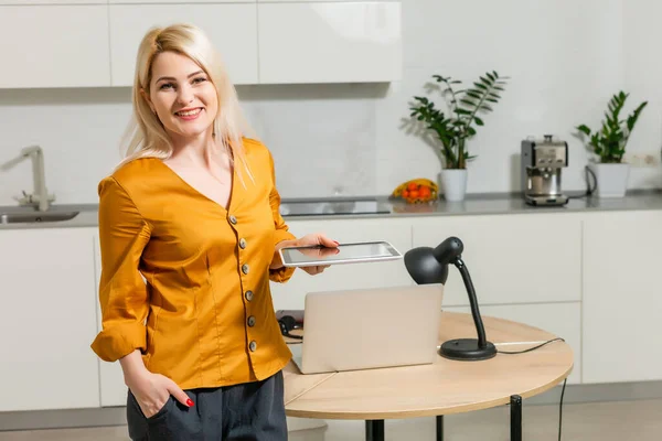 Remote working from home. Young woman using laptop. Freelancer ...