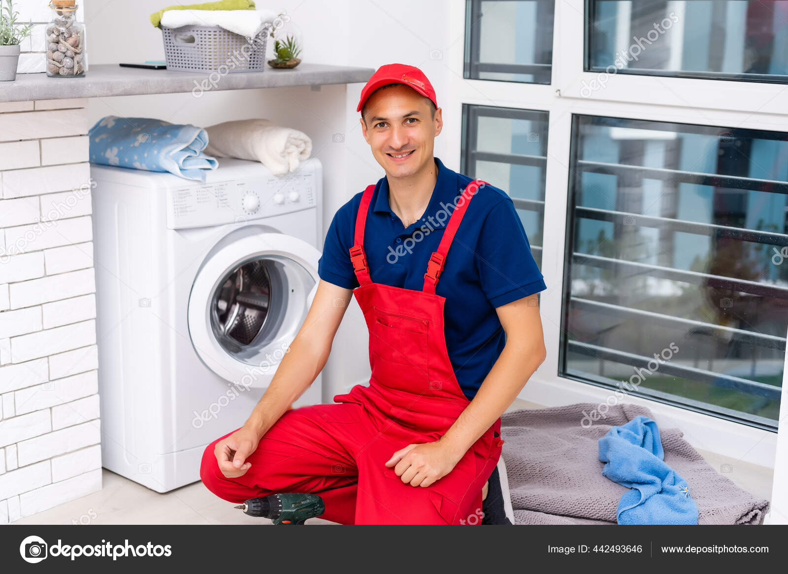 Master repairs the broken washing machine — Stock Photo © sinenkiy ...