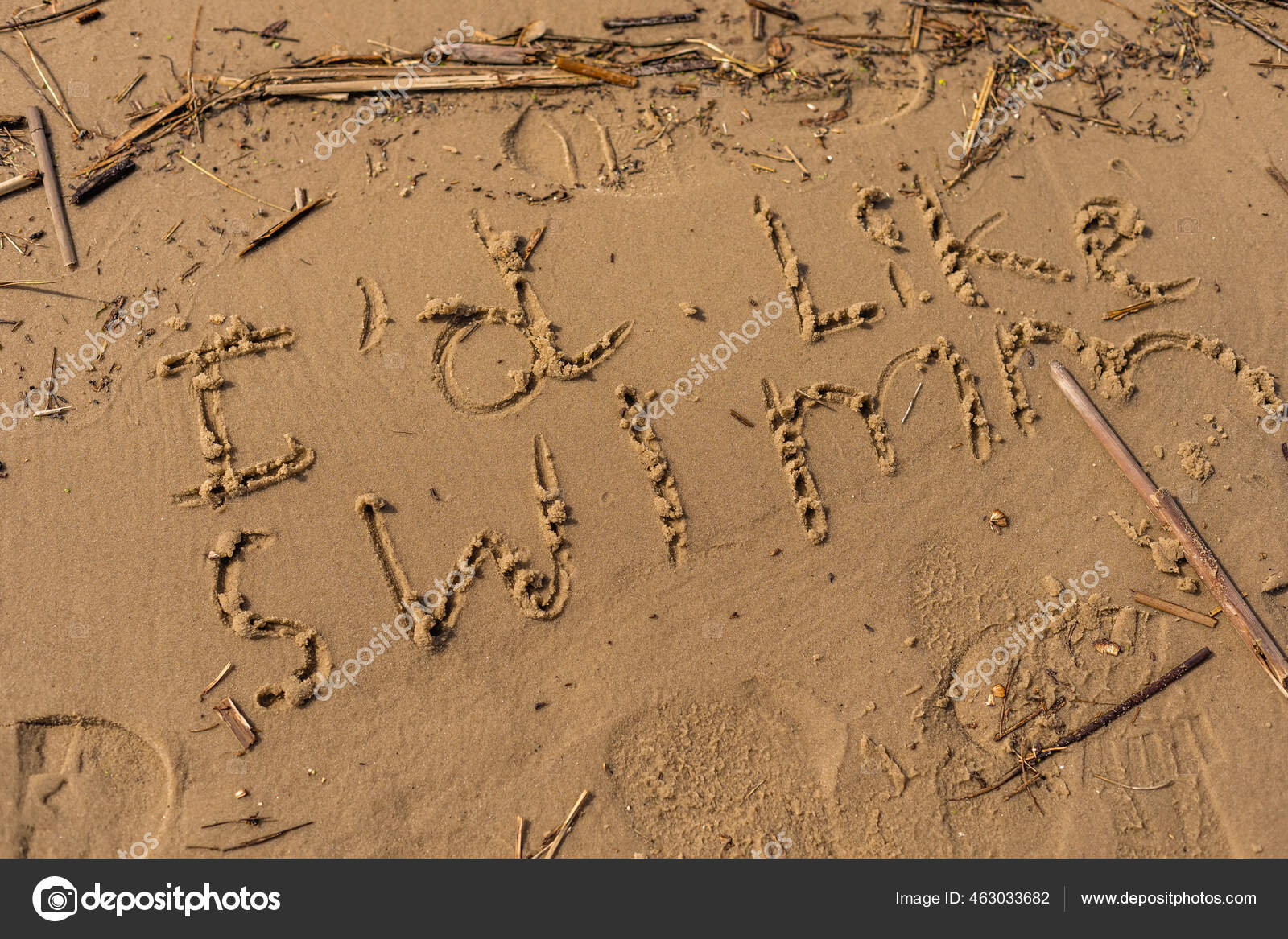 A lettering drawing on sand by the river Stock Photo by ©sinenkiy 463033682